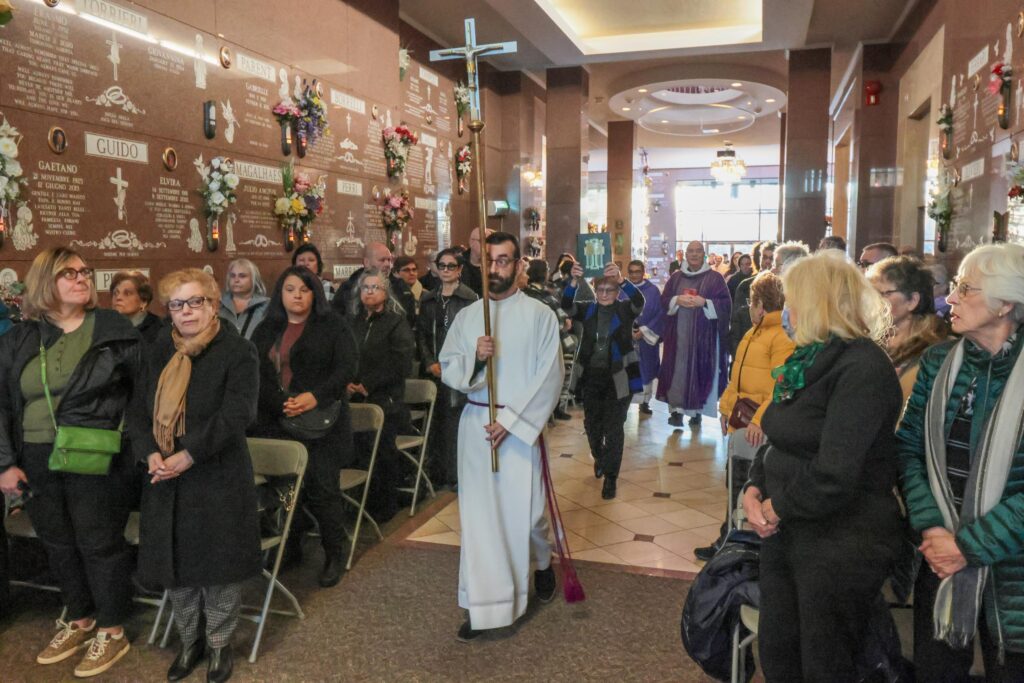 Families remember loved ones during Advent Mass at Holy Cross Cemetery ...