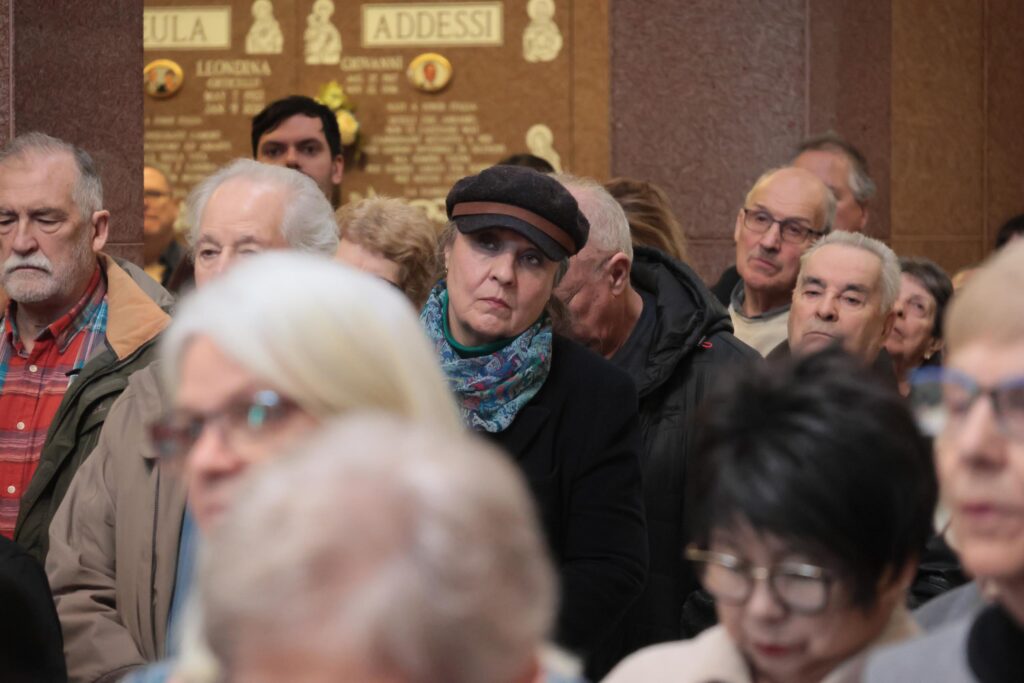 Families remember loved ones during Advent Mass at Holy Cross Cemetery ...